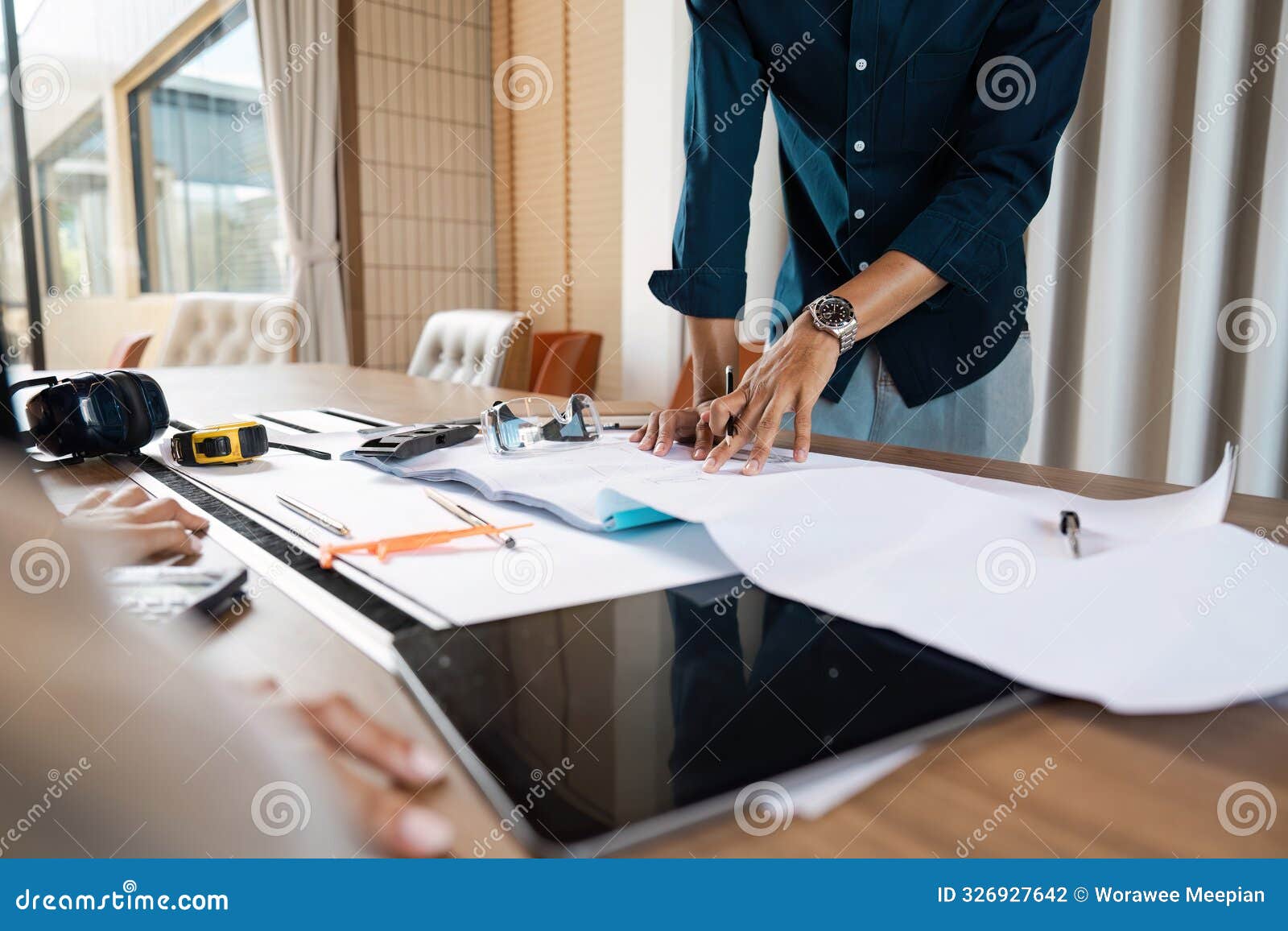 Collaborative Engineers Working on Architectural Blueprint and ...