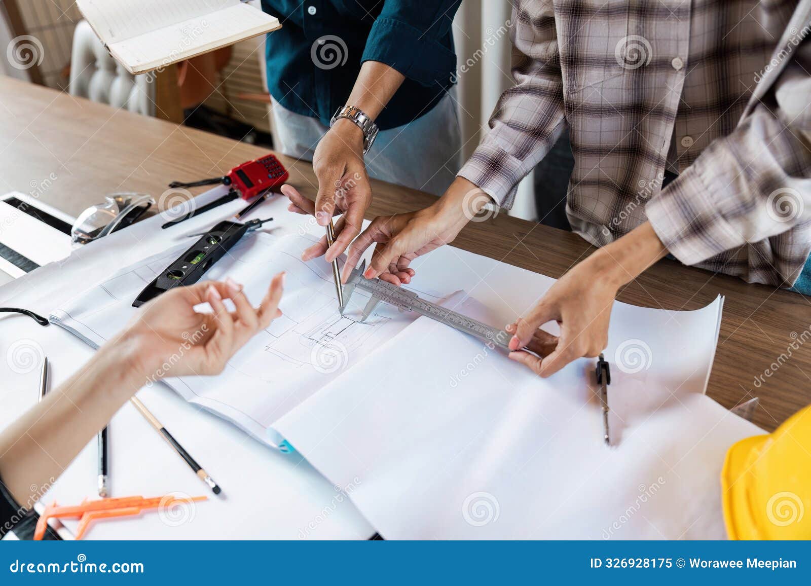 Collaborative Engineers Working on Architectural Blueprint and ...