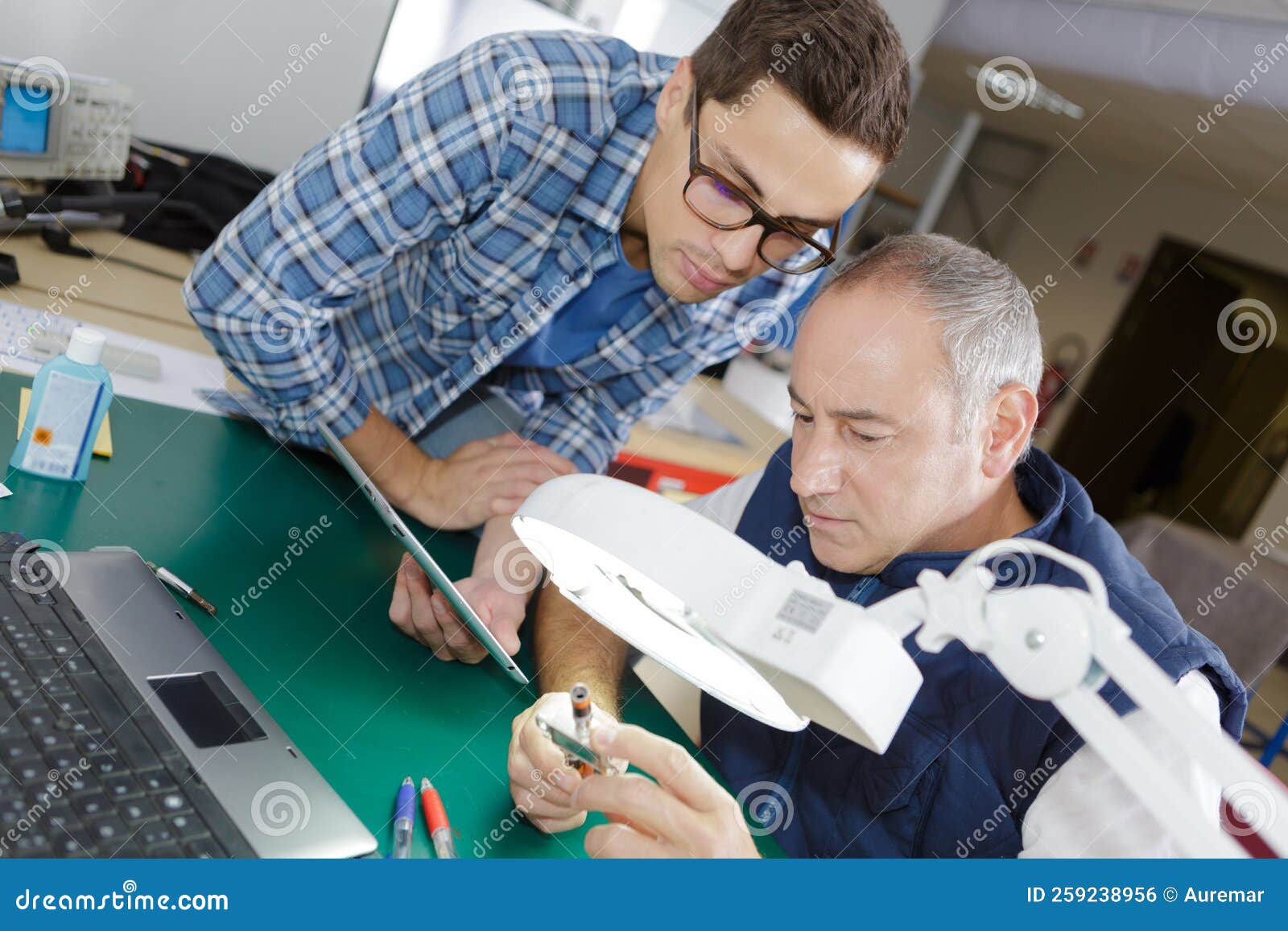 Engineer and Collegue with Magnifier in Hands Stock Photo - Image of ...