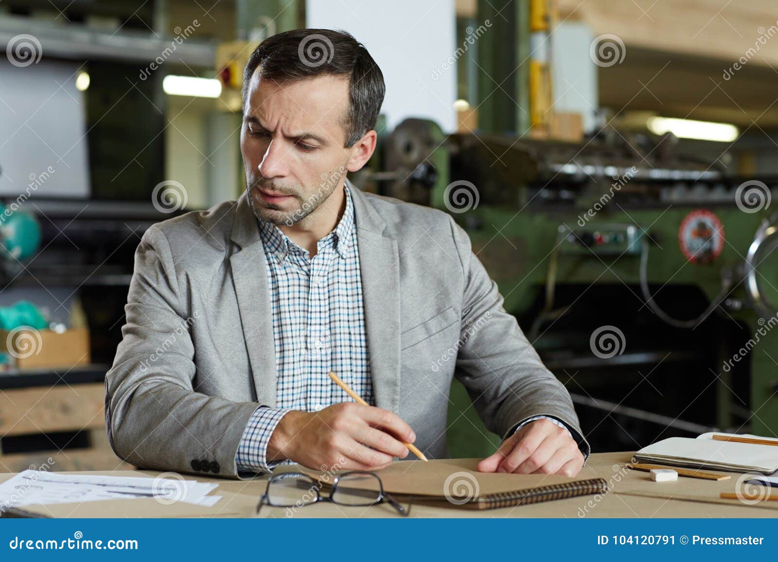 Engineer in workshop stock image. Image of note, formal - 104120791