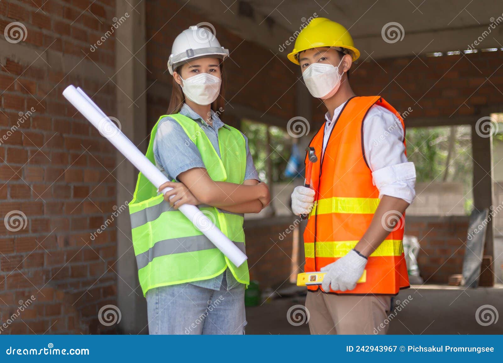 Engineer Concept the Two Engineers Holding Paper Plan, Hammer and Other ...