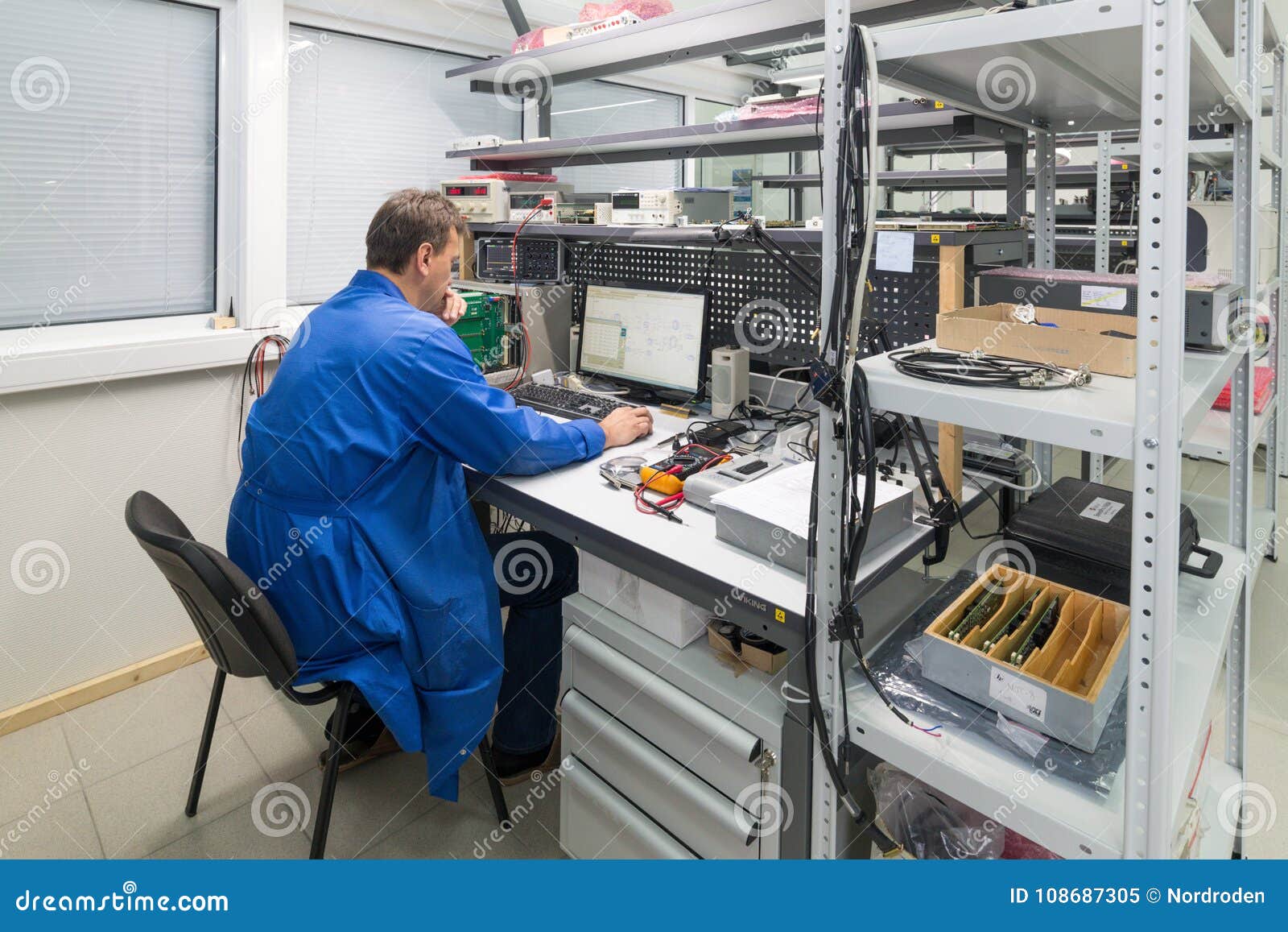 The Engineer Conducts a Test of the Finished Electronic Modules ...