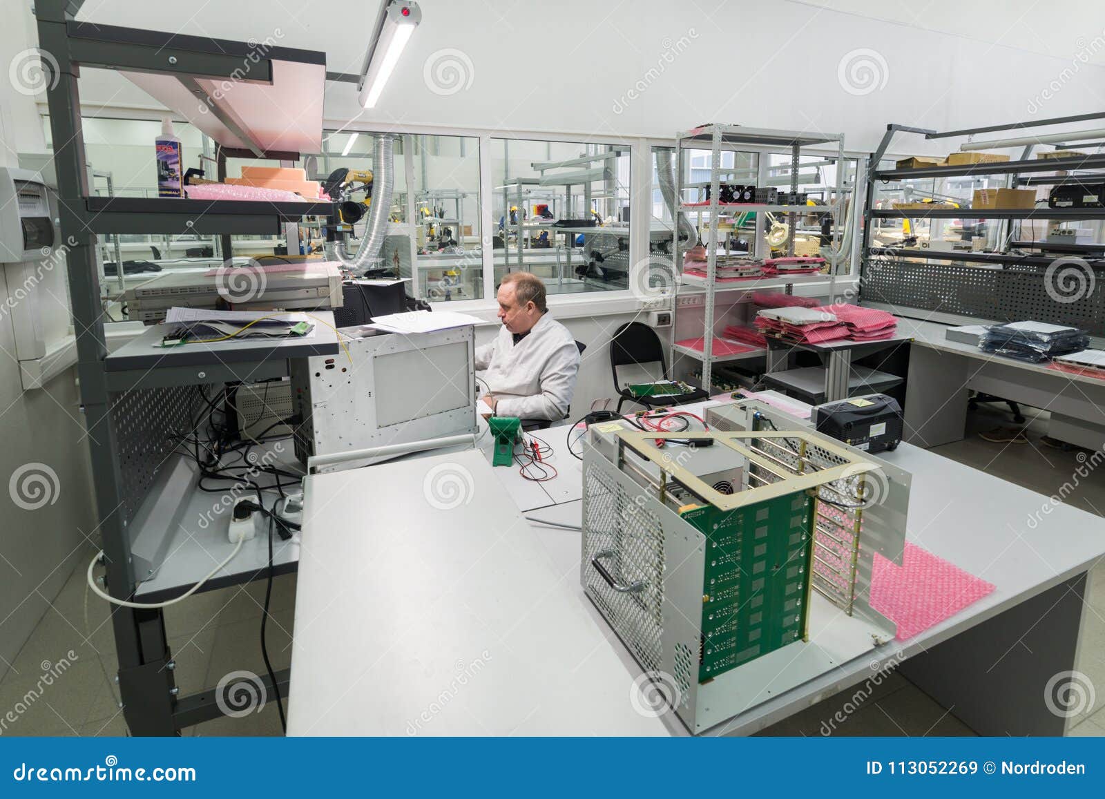 The Engineer Conducts a Test of the Finished Electronic Modules ...