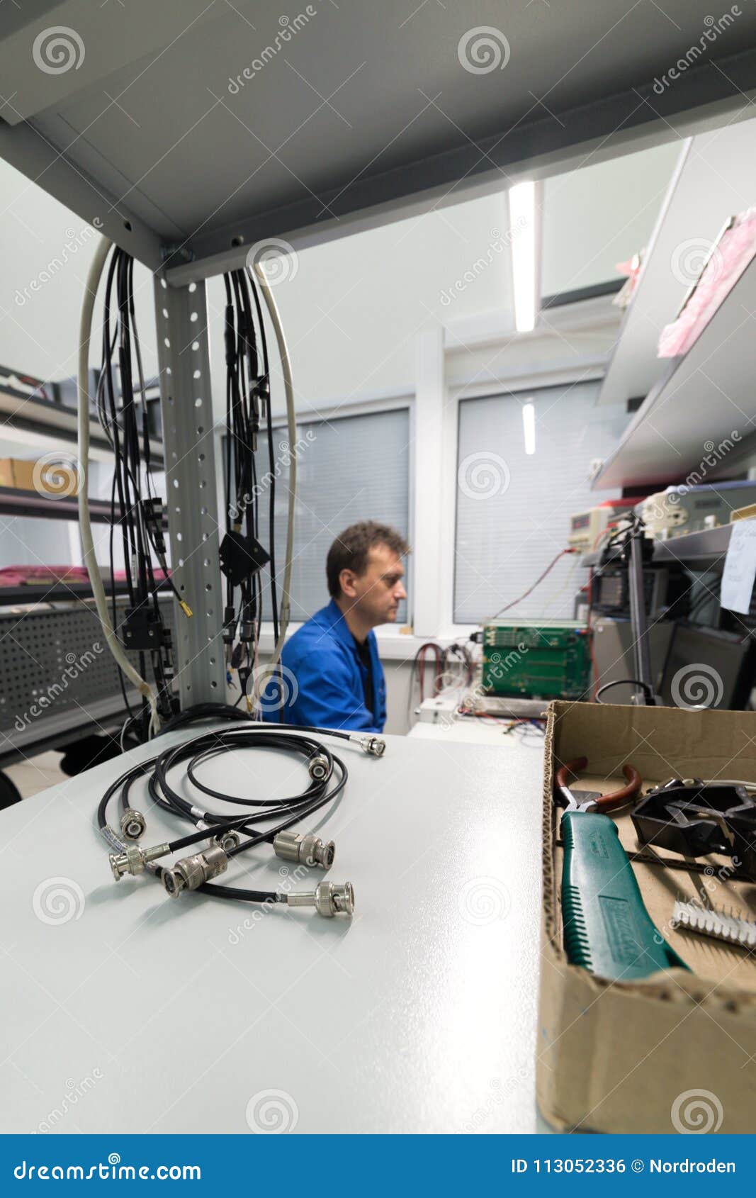 The Engineer Conducts a Test of the Finished Electronic Modules ...