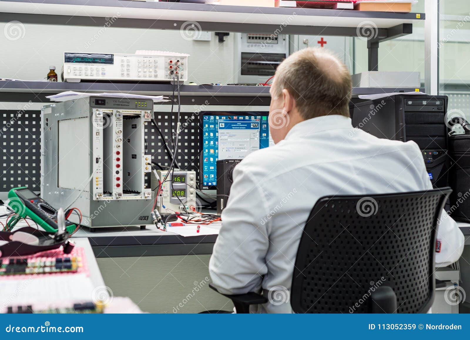 The Engineer Conducts a Test of the Finished Electronic Modules ...