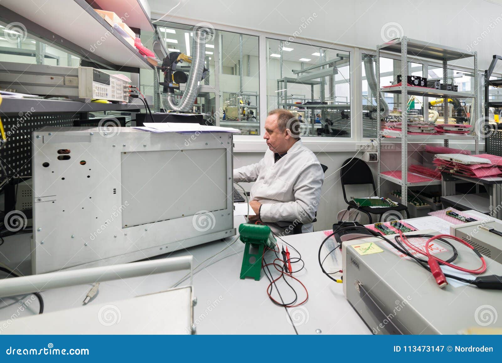 The Engineer Conducts a Test of the Finished Electronic Modules ...