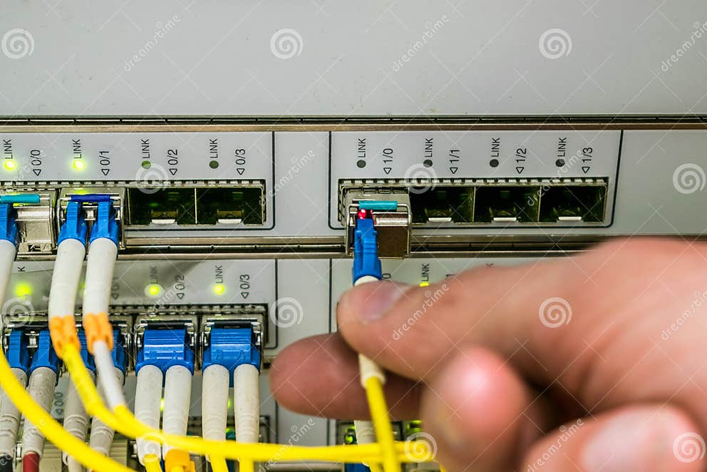The Engineer Connects the Optical Internet Cable with the Central ...