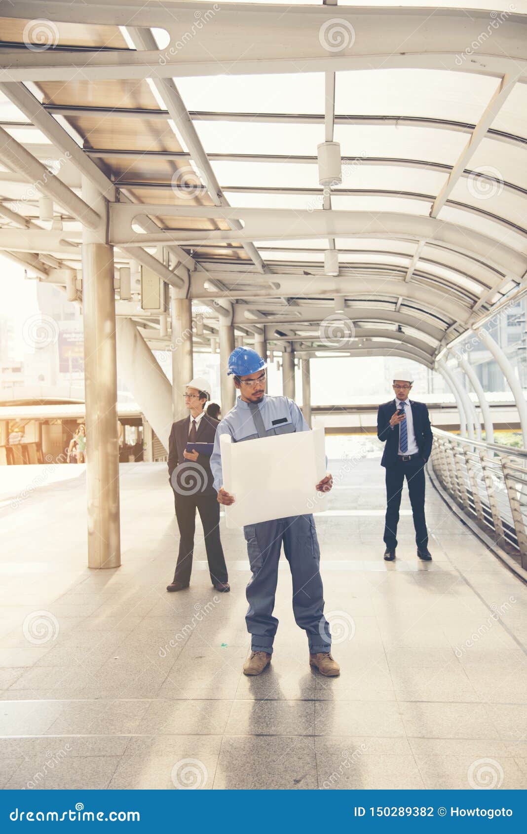 Engineer and Construction Manager Foreman Working on Building Site ...