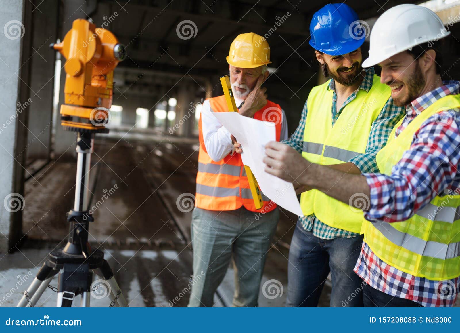 Engineer and Construction Site Manager Dealing with Blueprints and ...