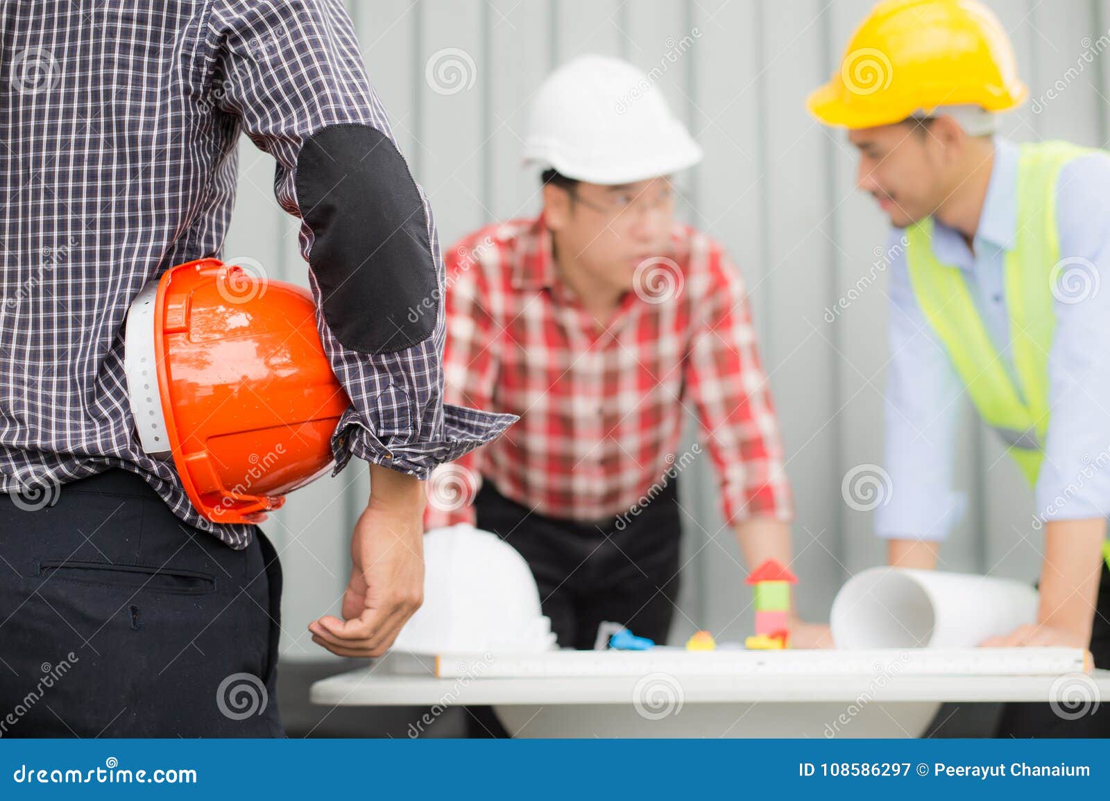 Engineer and Construction Team Wearing Safety Helmet and Looking ...