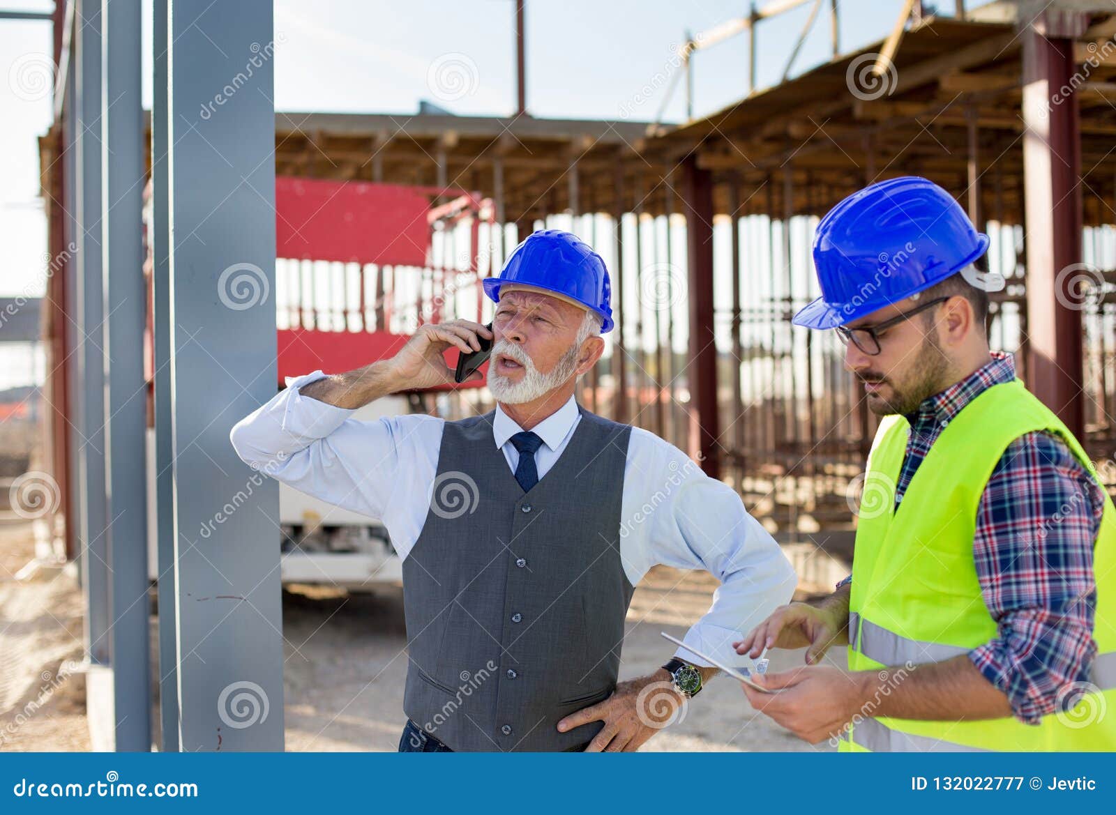 Engineer and Construction Worker at Building Site Stock Image - Image ...