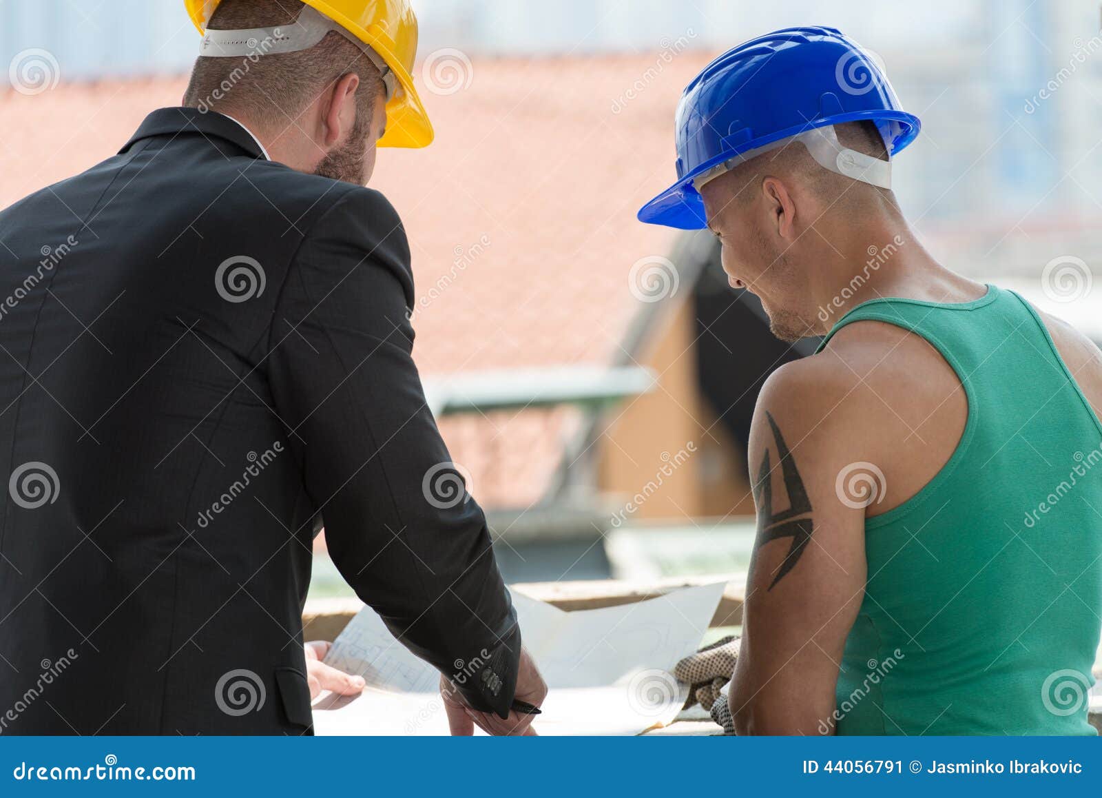 Engineer and Construction Worker Discussing a Project Stock Image ...