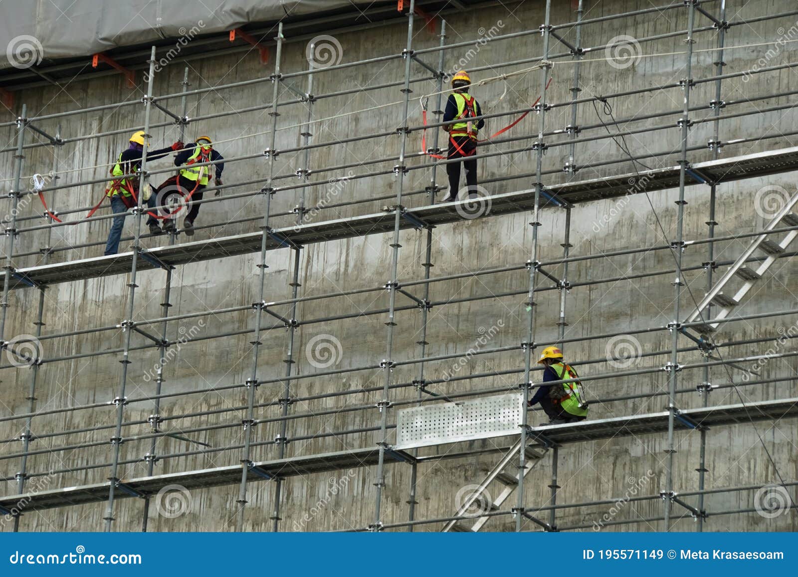 Engineer and Construction Workers on the Tall Buildings, on the ...