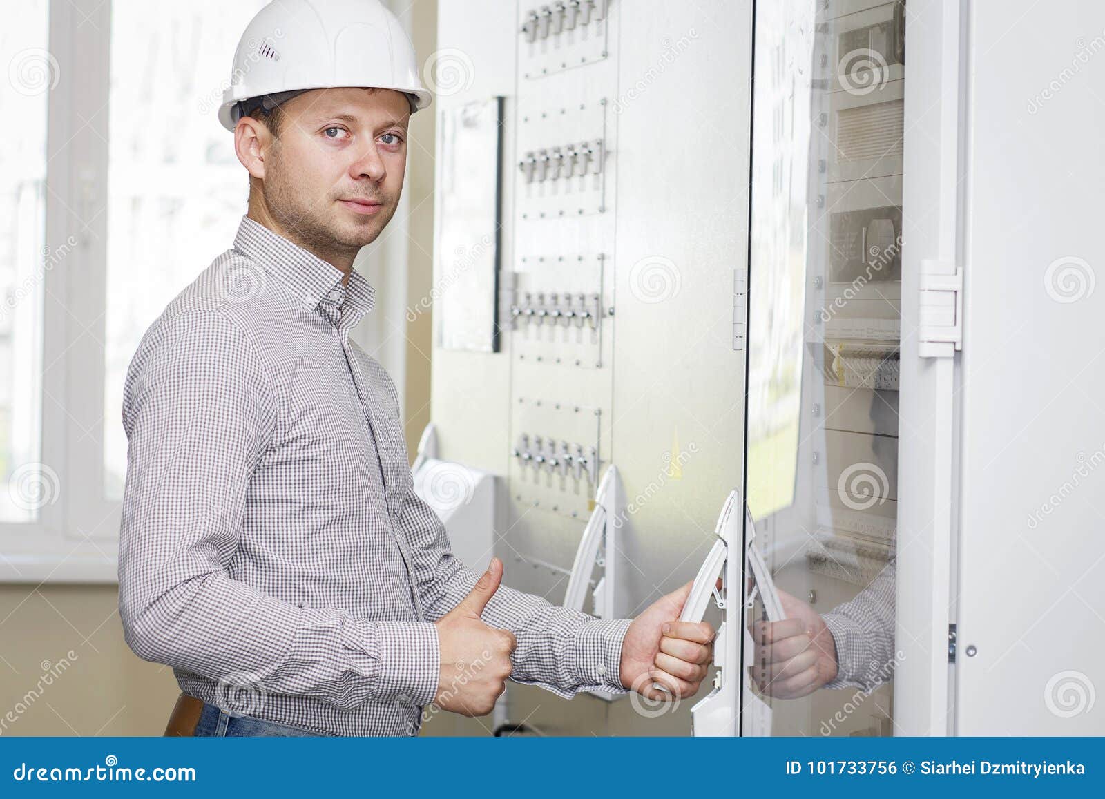 Engineer in Control Panel Room. Worker in White Helmet on Industrial ...