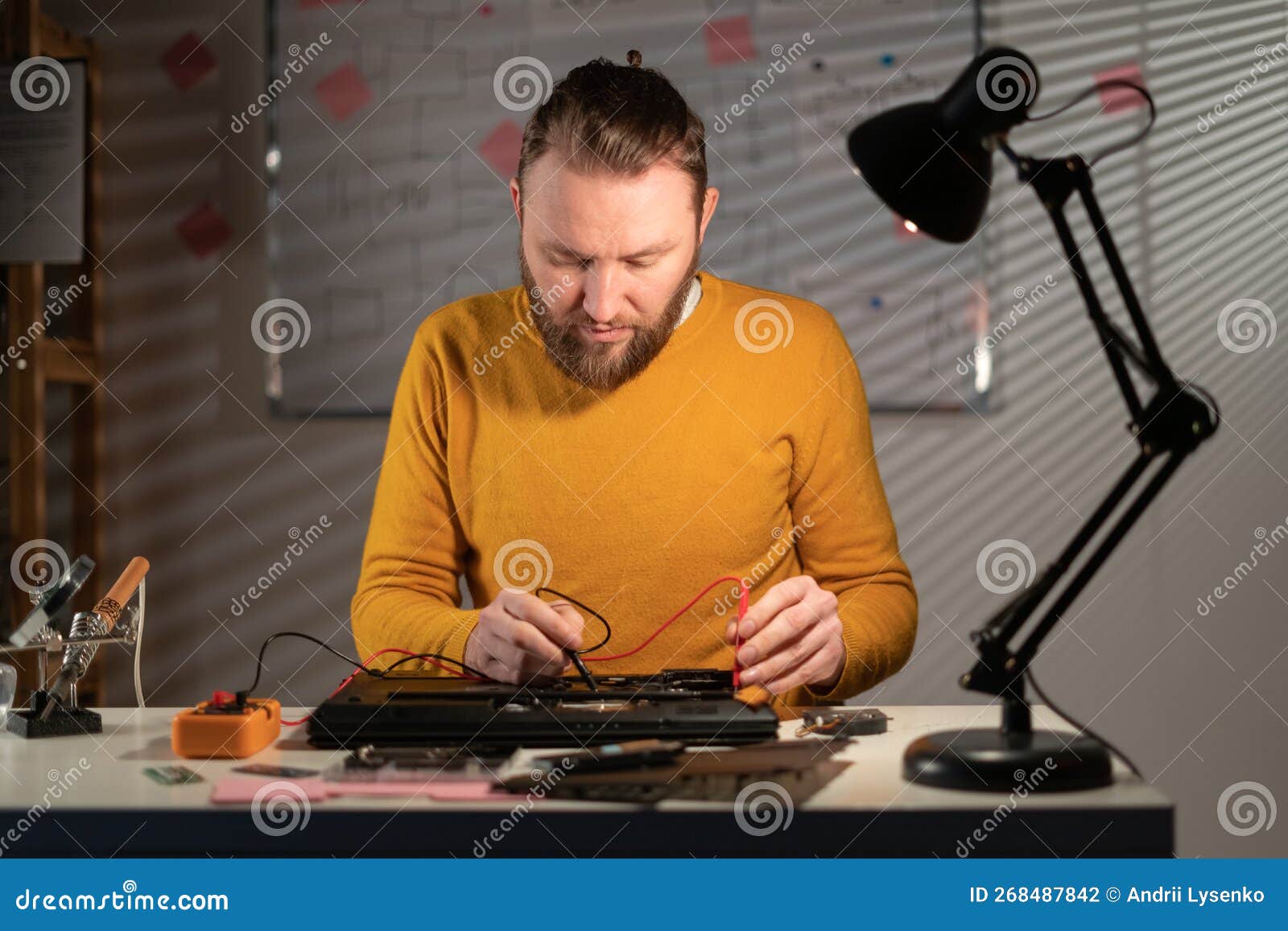 Engineer Diagnosing Laptop Computer Using Multimeter, Repairing Broken ...