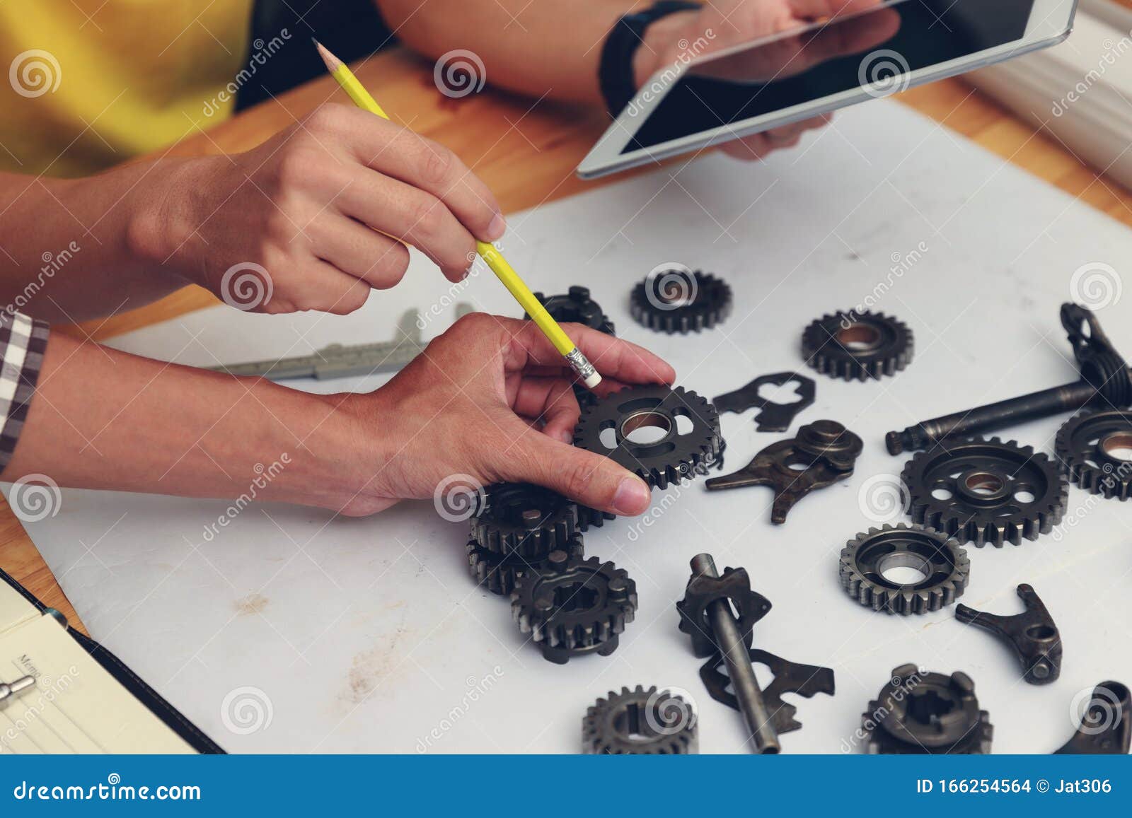 Engineer Discussing and Designing about Mechanical Gear Parts in Office ...