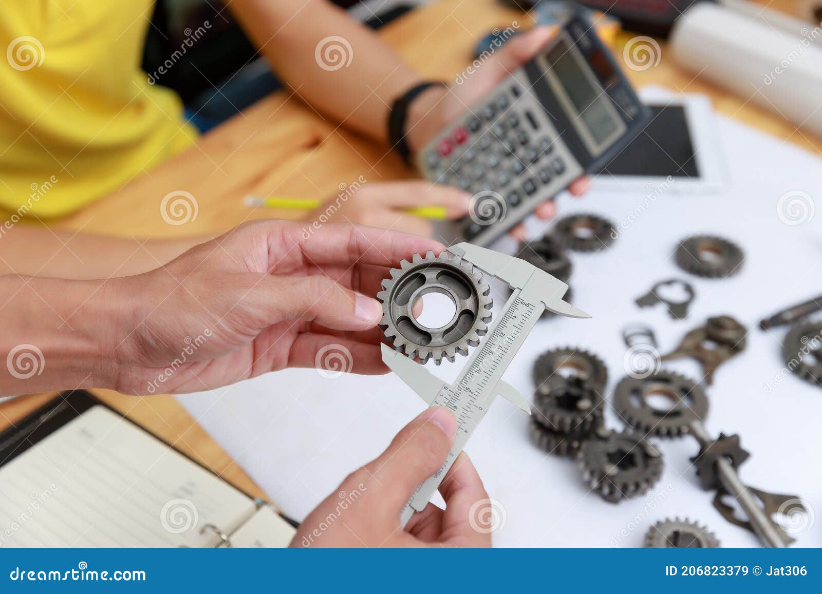 Engineer Discussing and Designing about Mechanical Gear Parts in Office ...