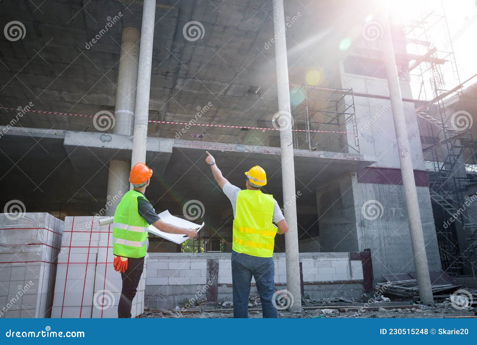 Engineer Discussing with Foreman about Project in Building Construction ...