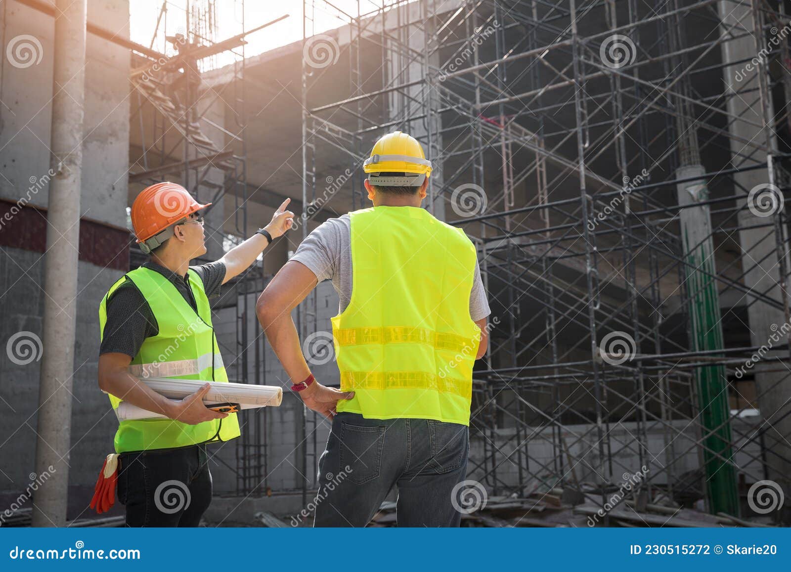 Engineer Discussing with Foreman about Project in Building Construction ...