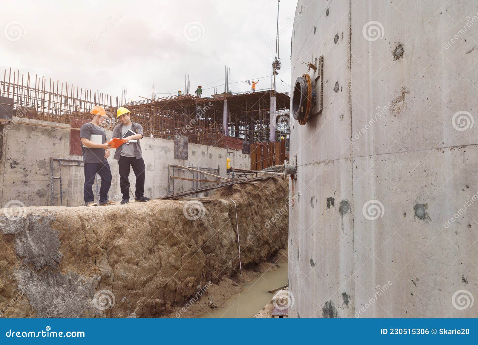 Engineer Discussing with Foreman about Project in Building Construction ...