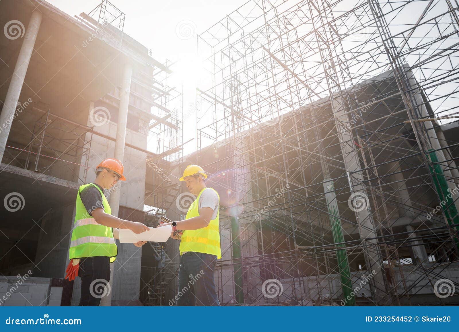 Engineer Discussing with Foreman about Project in Building Construction ...
