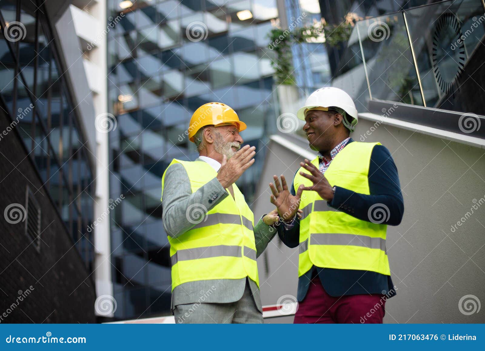 Engineer Discussing the Structure of the Building with Architects ...