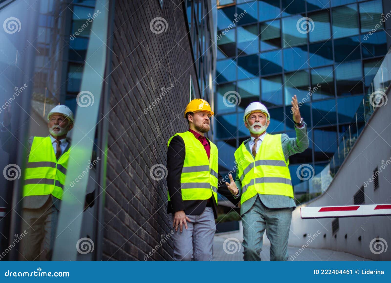 Engineer Discussing the Structure of the Building with Architects ...