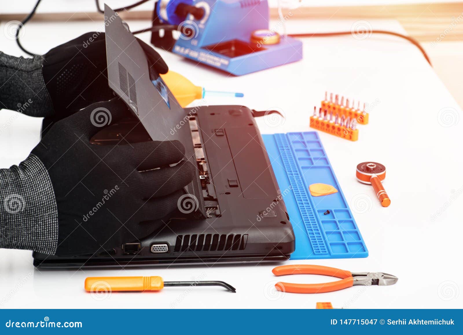 Engineer Dismantles the Details of a Broken Laptop for Repair Stock ...