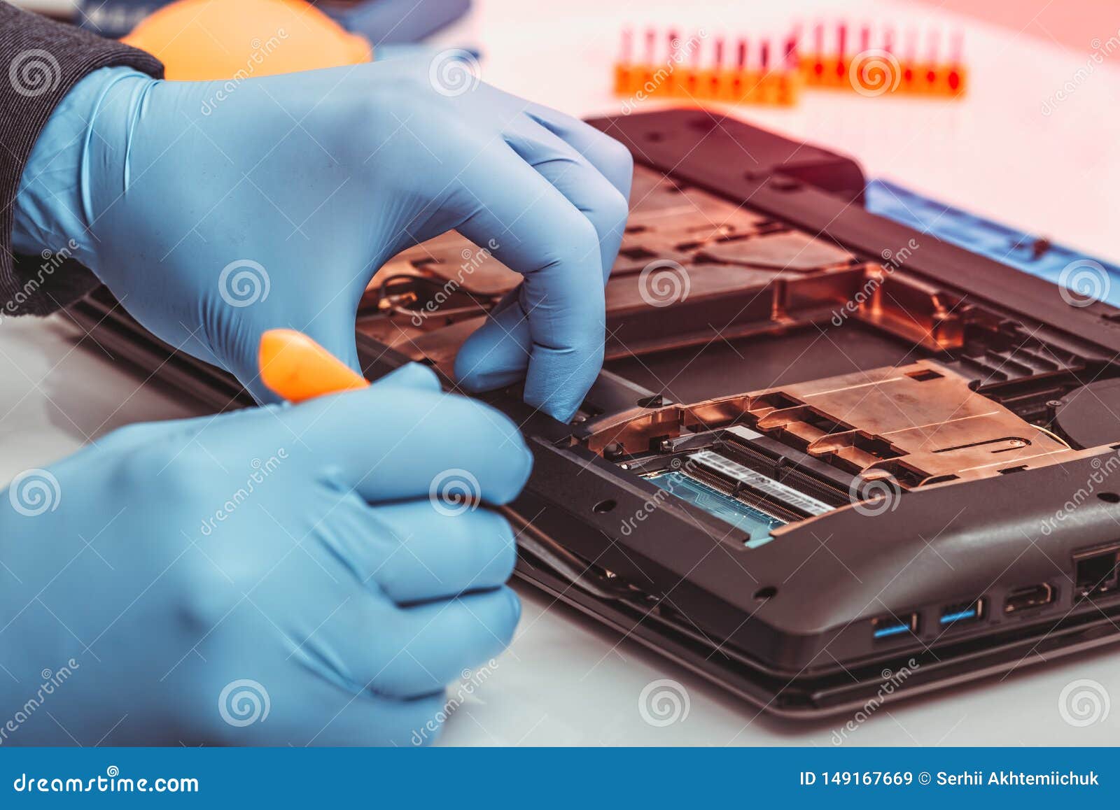 Engineer Dismantles The Details Of A Broken Laptop For Repair Royalty ...