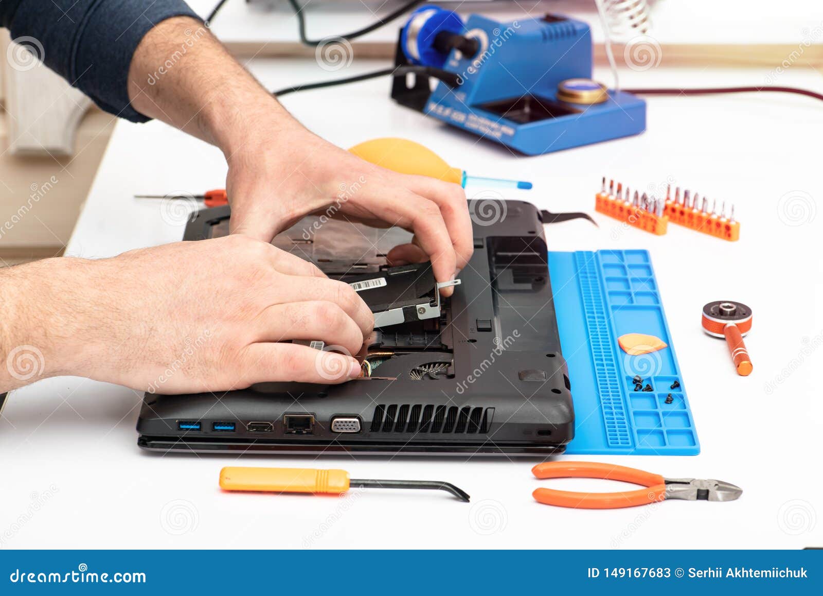 Engineer Dismantles The Details Of A Broken Laptop For Repair Royalty ...