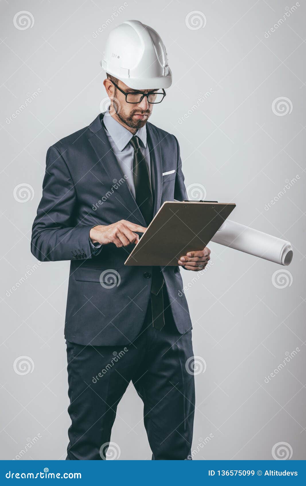 Engineer with Drafts Examining Clipboard Stock Image - Image of ...