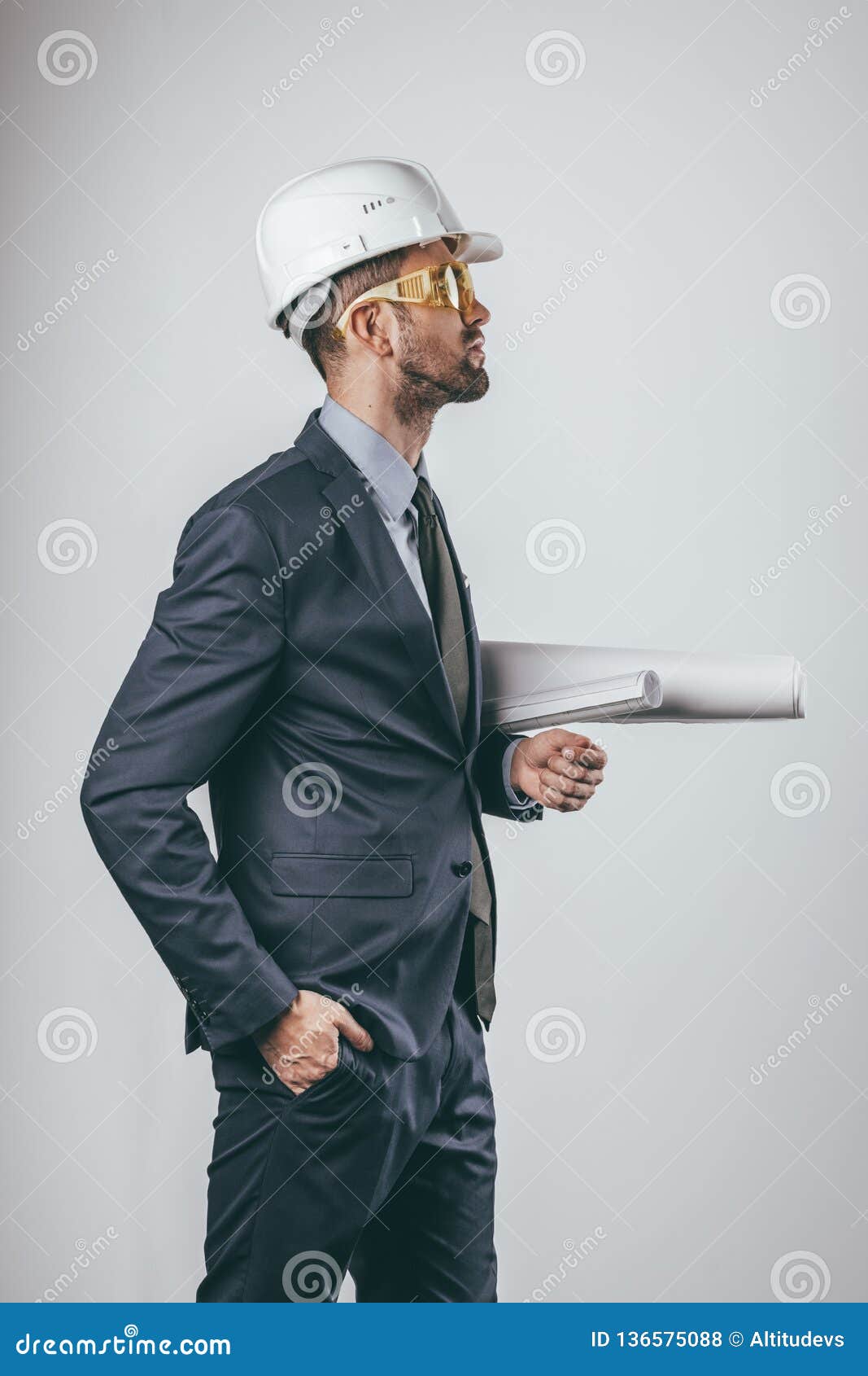Engineer with Drafts Looking Away Stock Photo - Image of blueprints ...