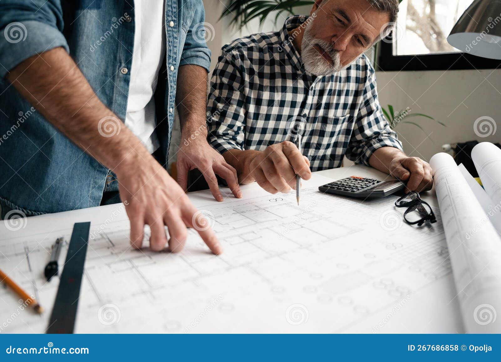 Engineer Drawing Plan on Blue Print with Architect Equipment ...