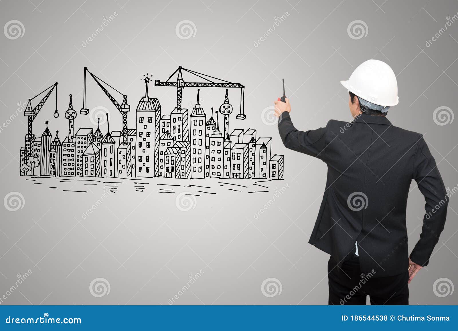 Engineer Drawing Plan a Construction Project with Pencil at ...
