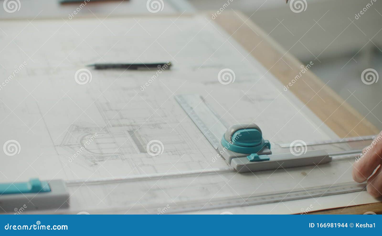 Engineer Draws Buildings on the Table Using a Pencil and Ruler. an ...