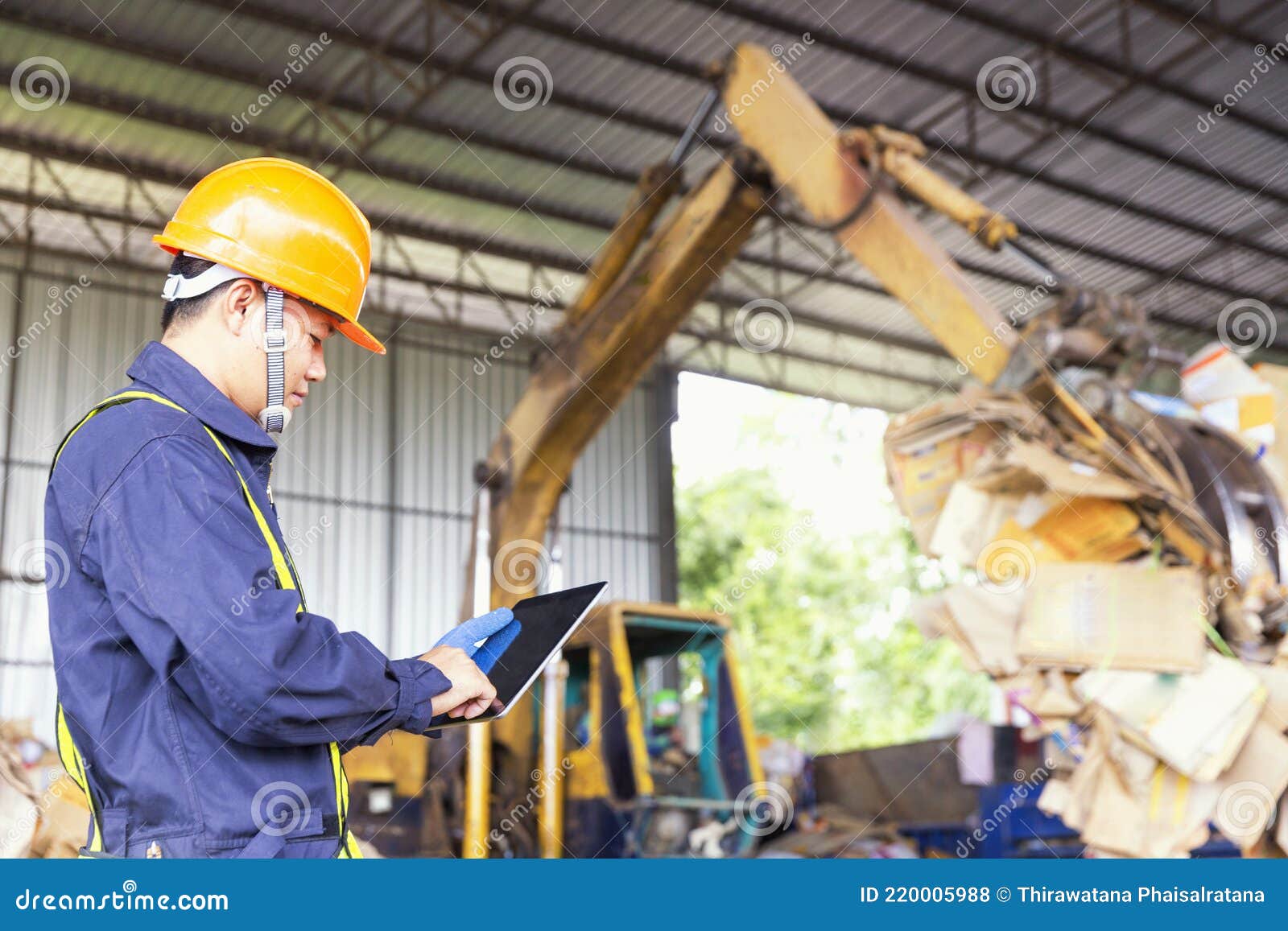 Engineer Driving a Loader in the Recycling Plant. Factory Recycle ...