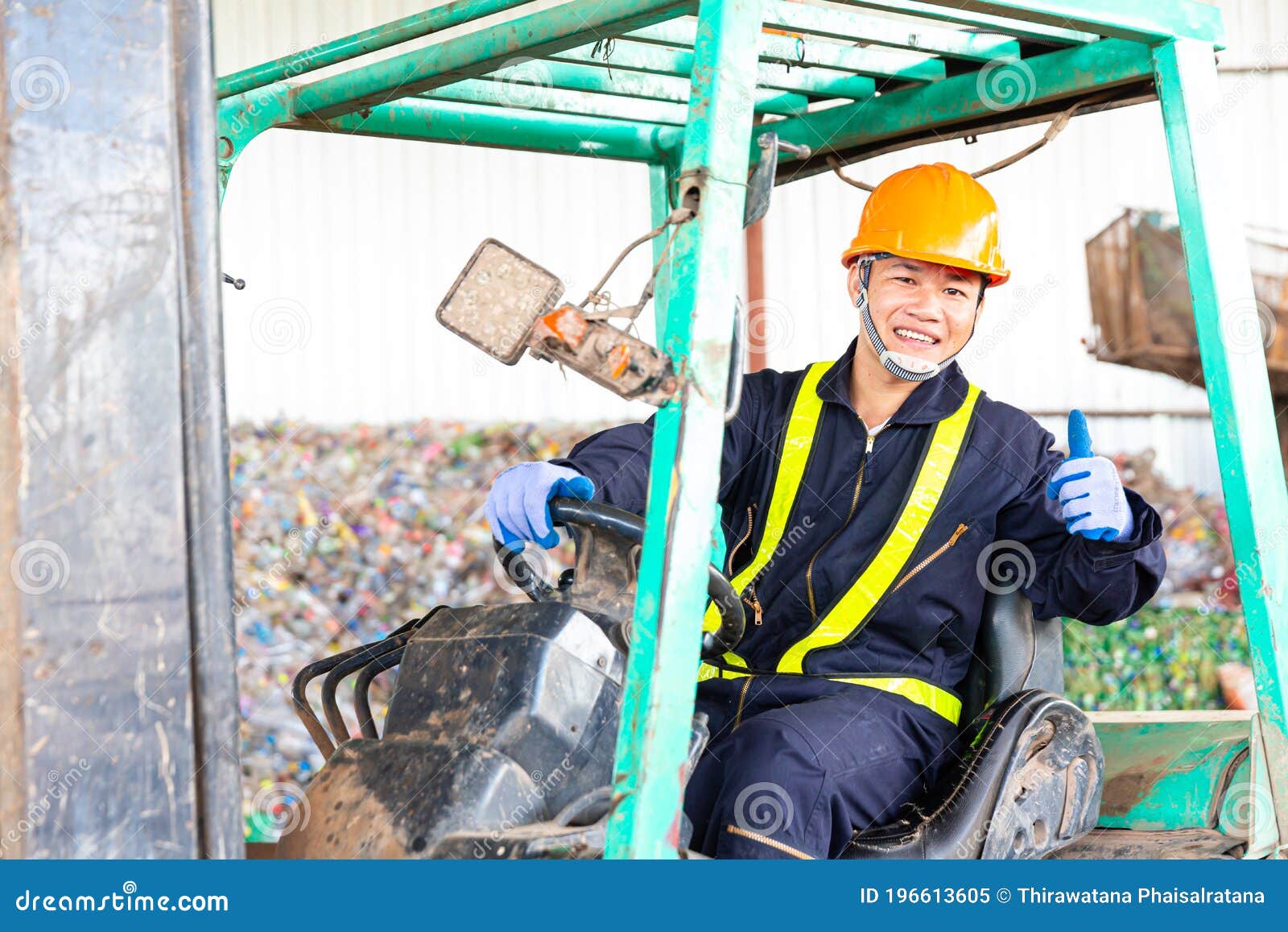 Engineer Driving a Loader in the Recycling Plant. Staff Thumbs Up Stock ...