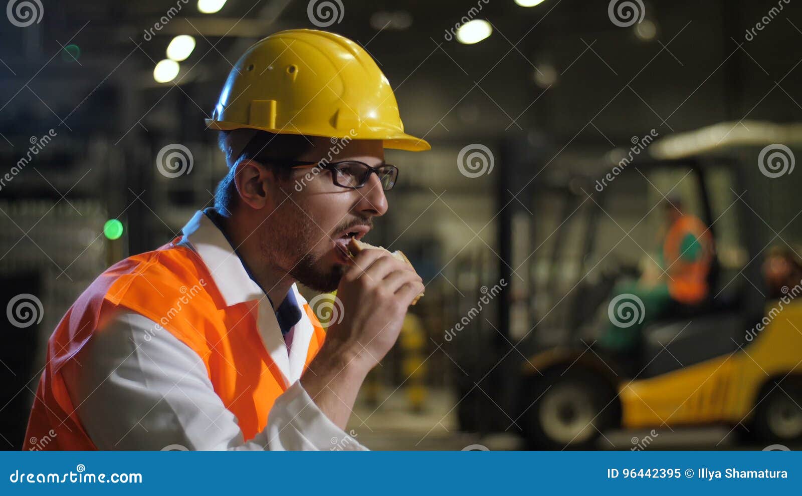 Engineer eating sandwich stock video. Video of workwear - 96442395