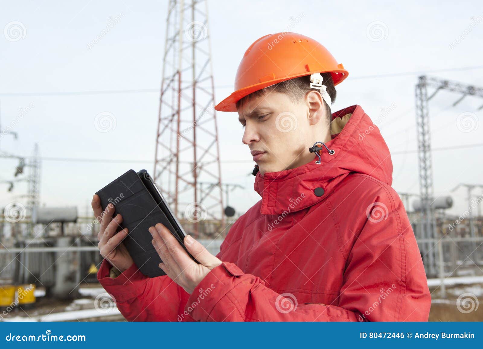 Engineer at Electrical Substation Using a Tablet Computer Stock Photo ...