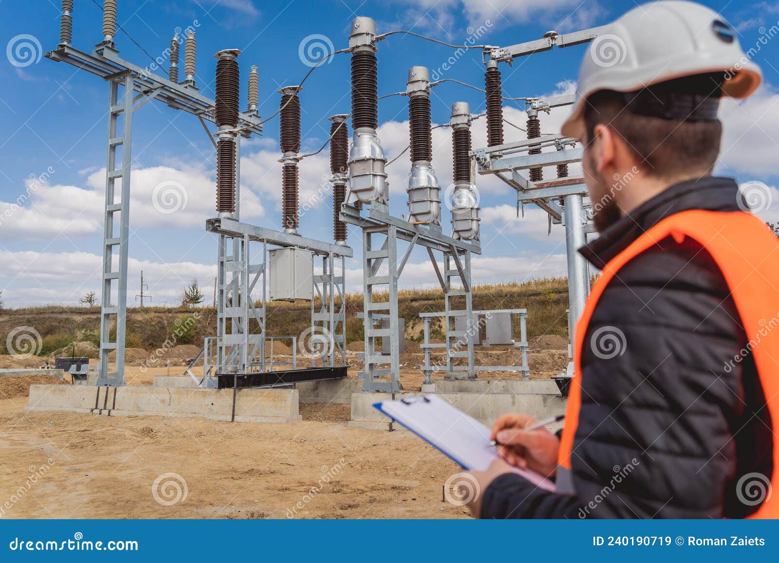 Engineer Electrician Workers On Lift Repairing Electricity Pylon ...