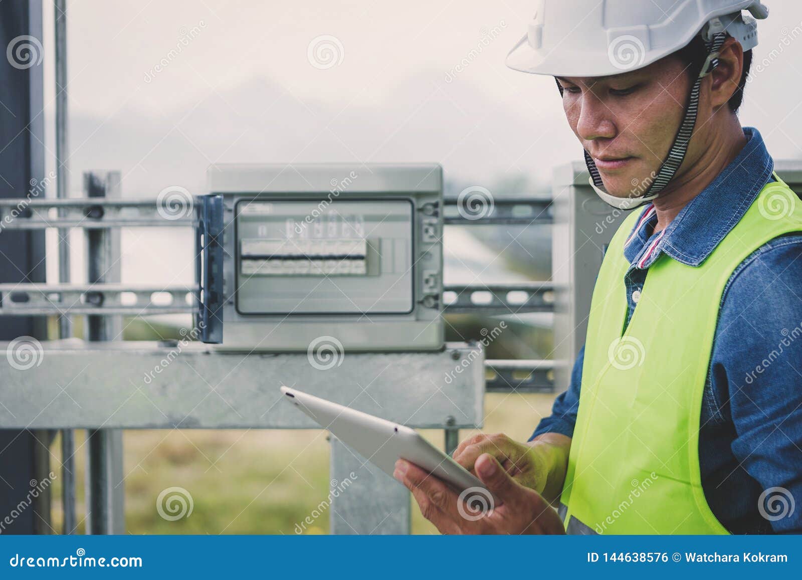 Engineer or Electrician Holding Laptop for Inspect and Checking Main ...
