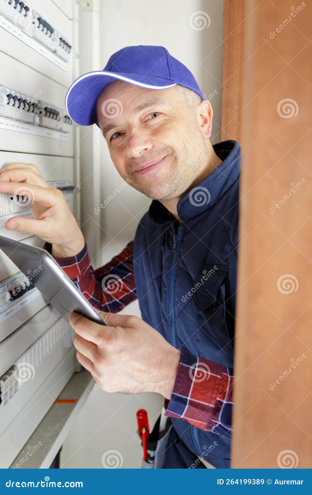 Engineer Electrician with Multimeter in Electrical Control Box Stock ...