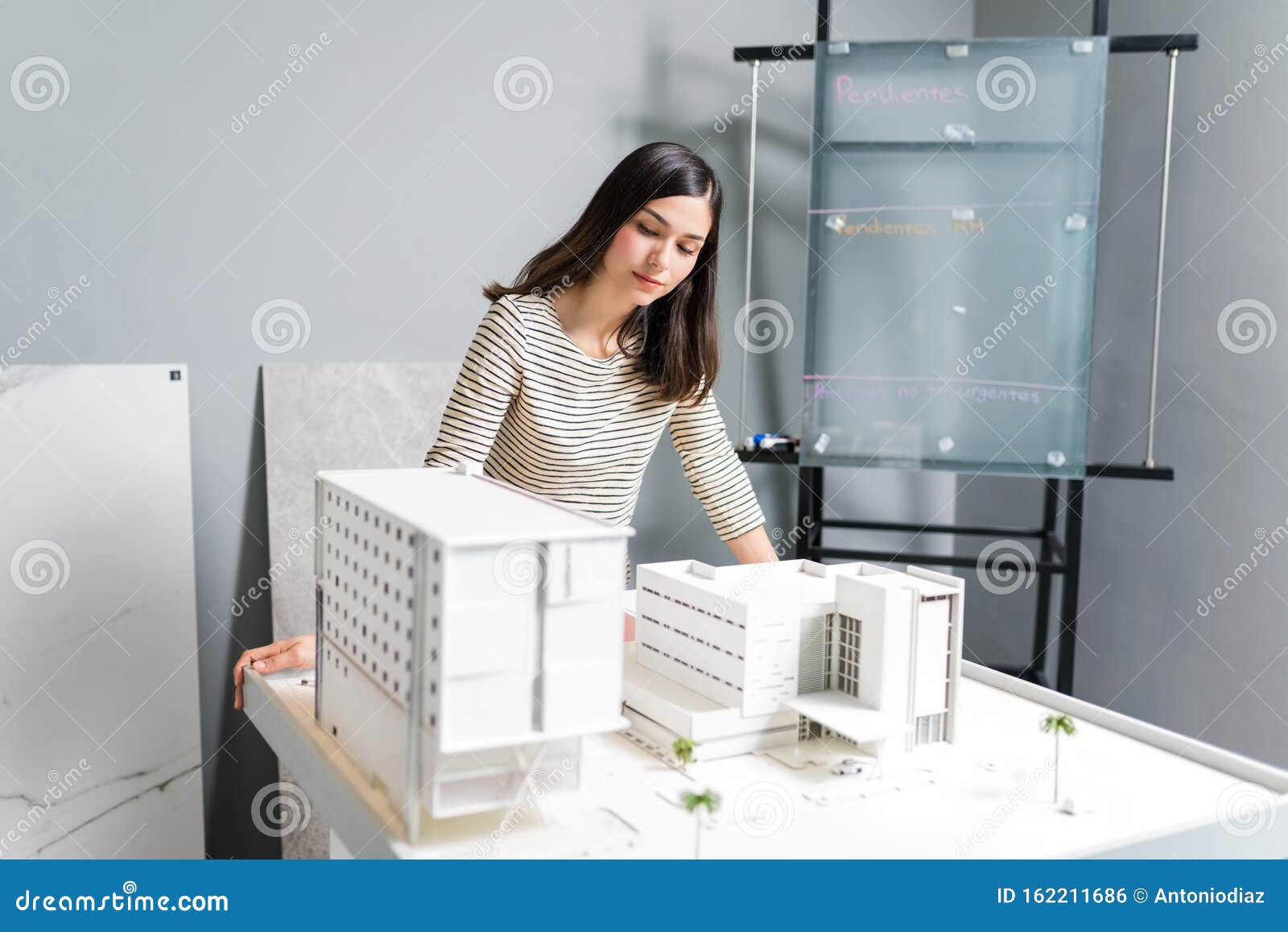 Engineer Examines Model at Workshop Stock Photo - Image of looking ...