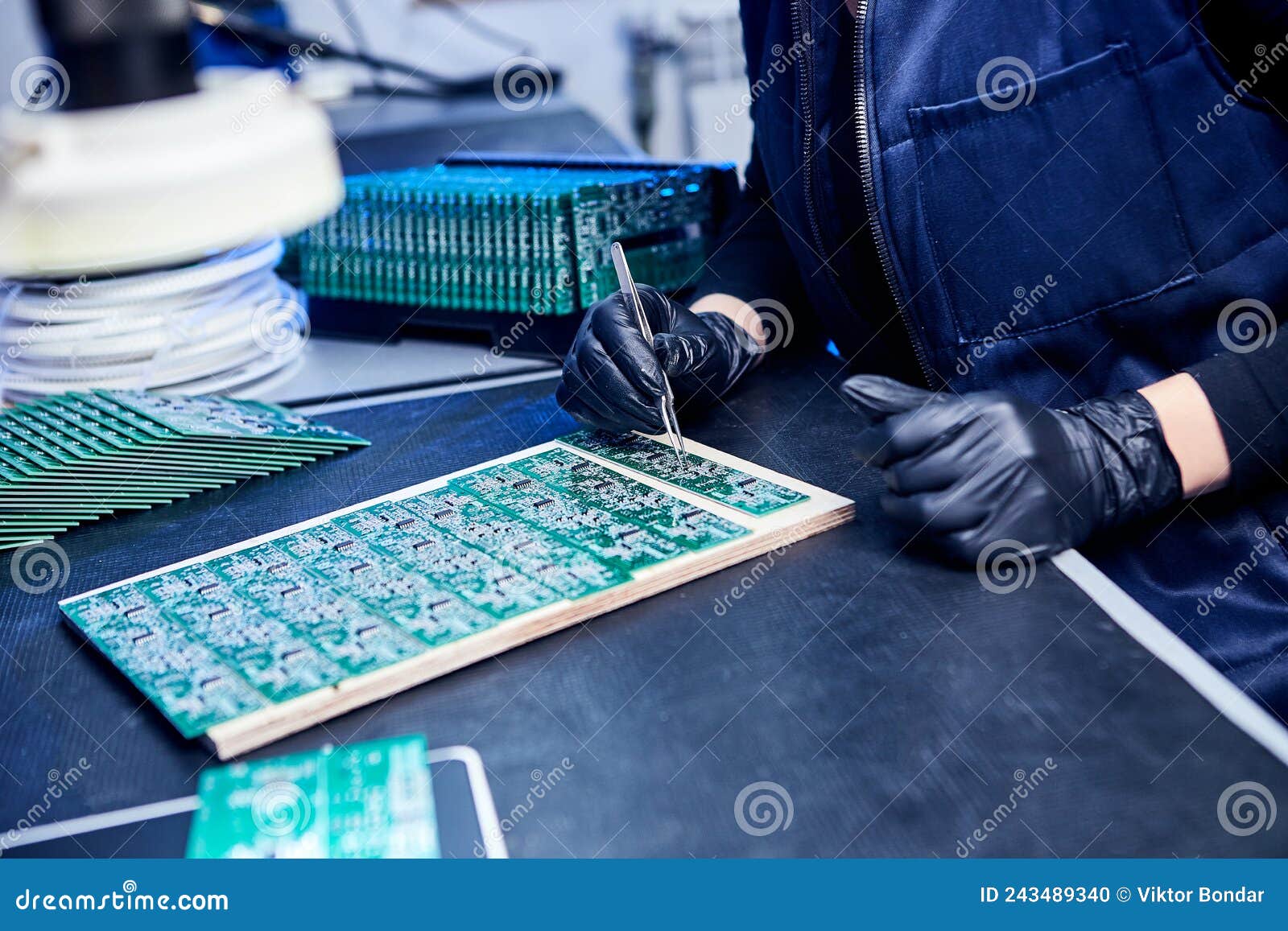 Engineer Factory Worker Electronics Works with a Chip Board. Microchip ...