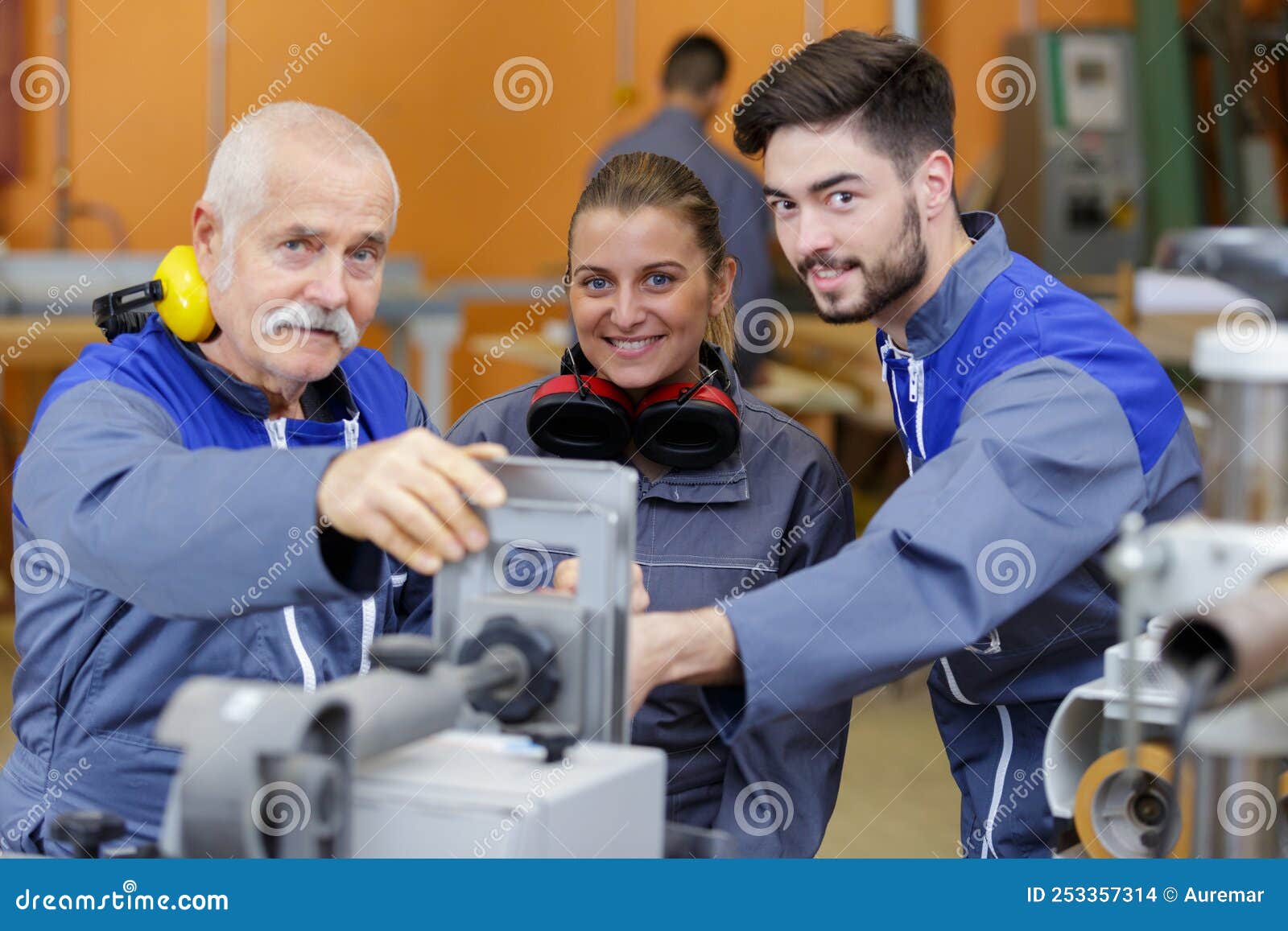Engineer and Female Apprentice Measuring Components in Factory Stock ...