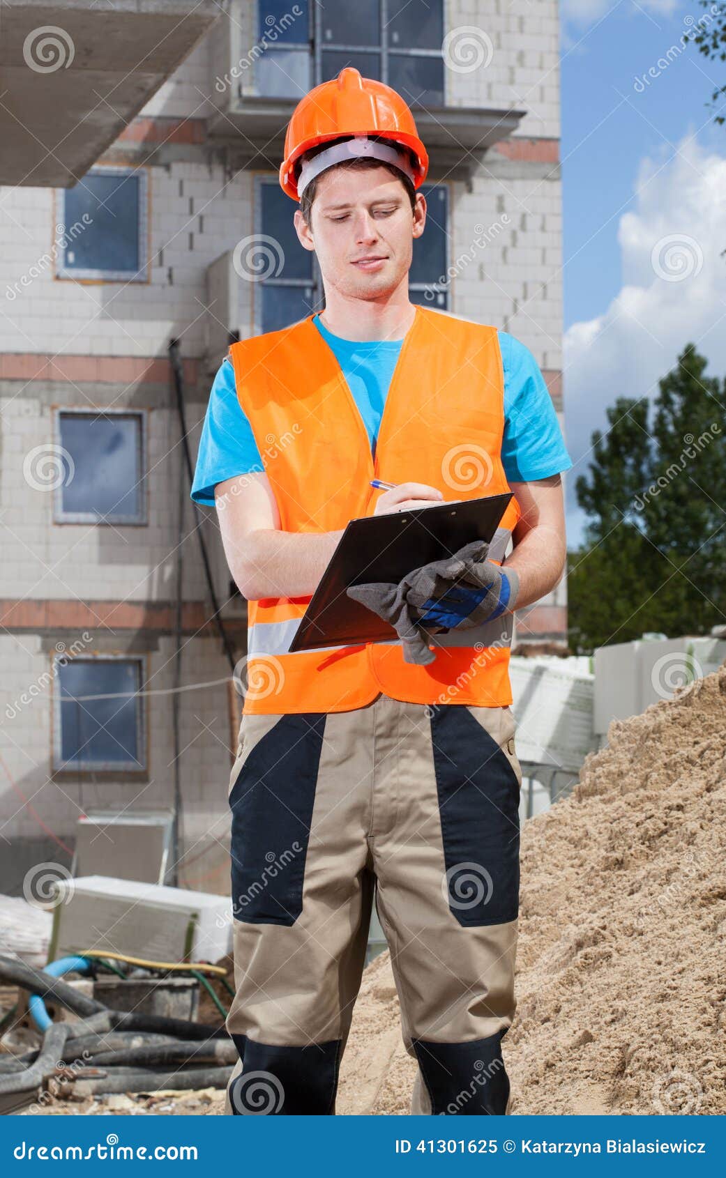 Engineer Filling Papers at Building Site Stock Image - Image of ...