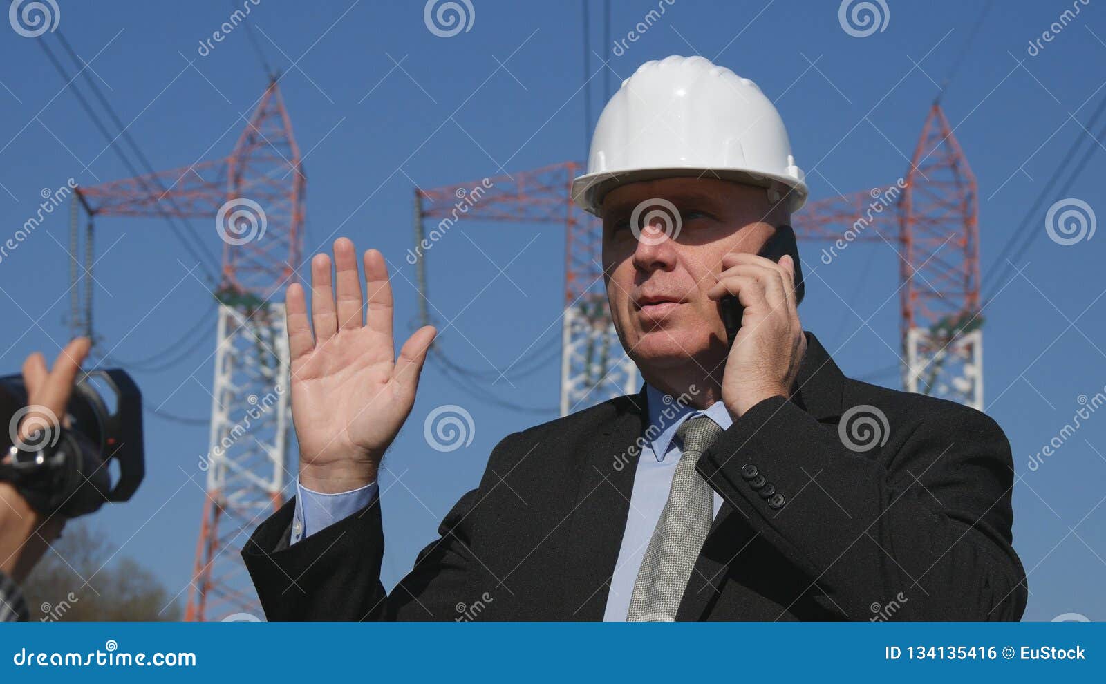 Engineer Filmed by a Reporter Use Cell Phone Talking with Maintenance ...