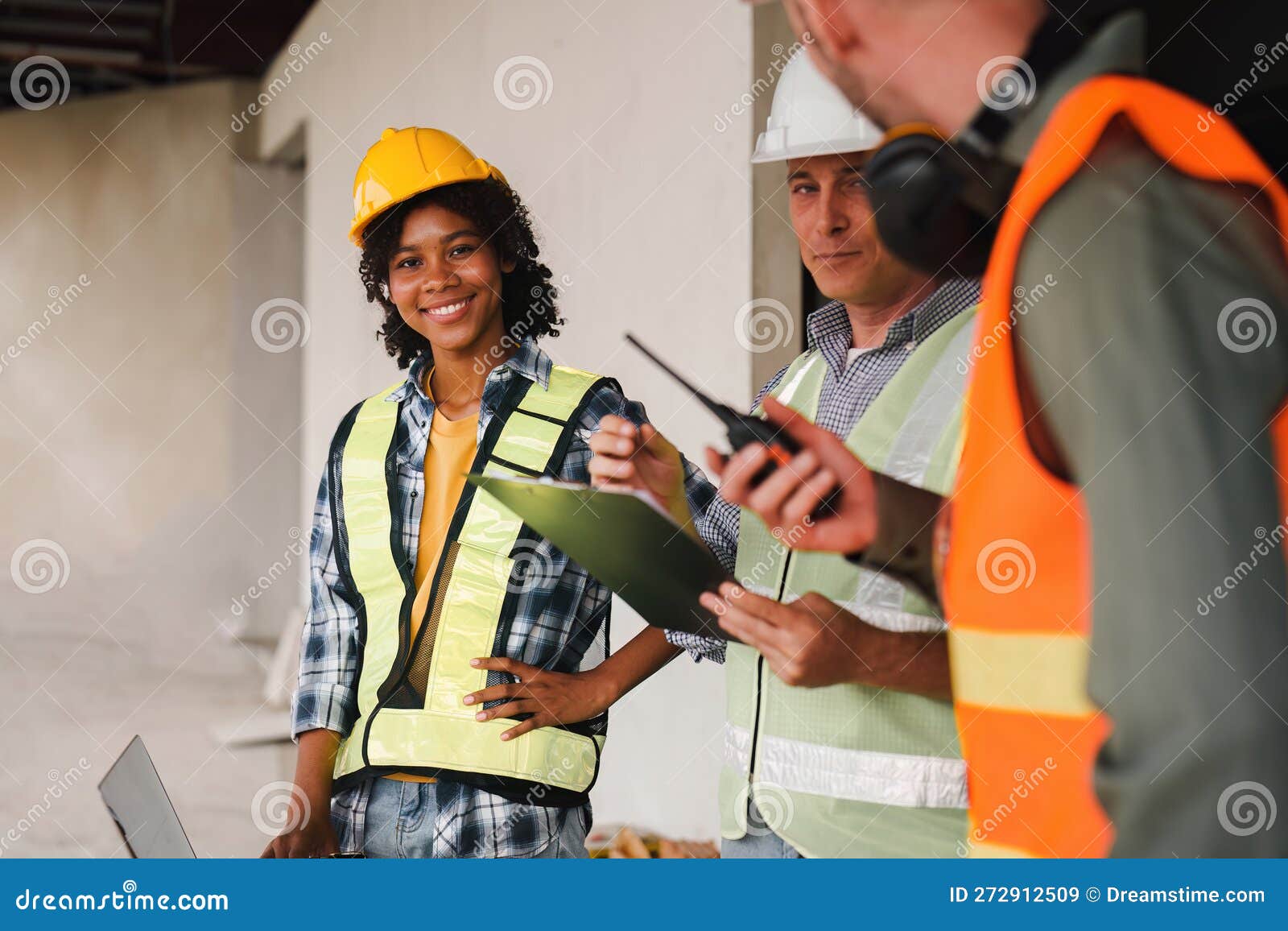 Engineer and Foreman Builder Team at Construction Site. American ...