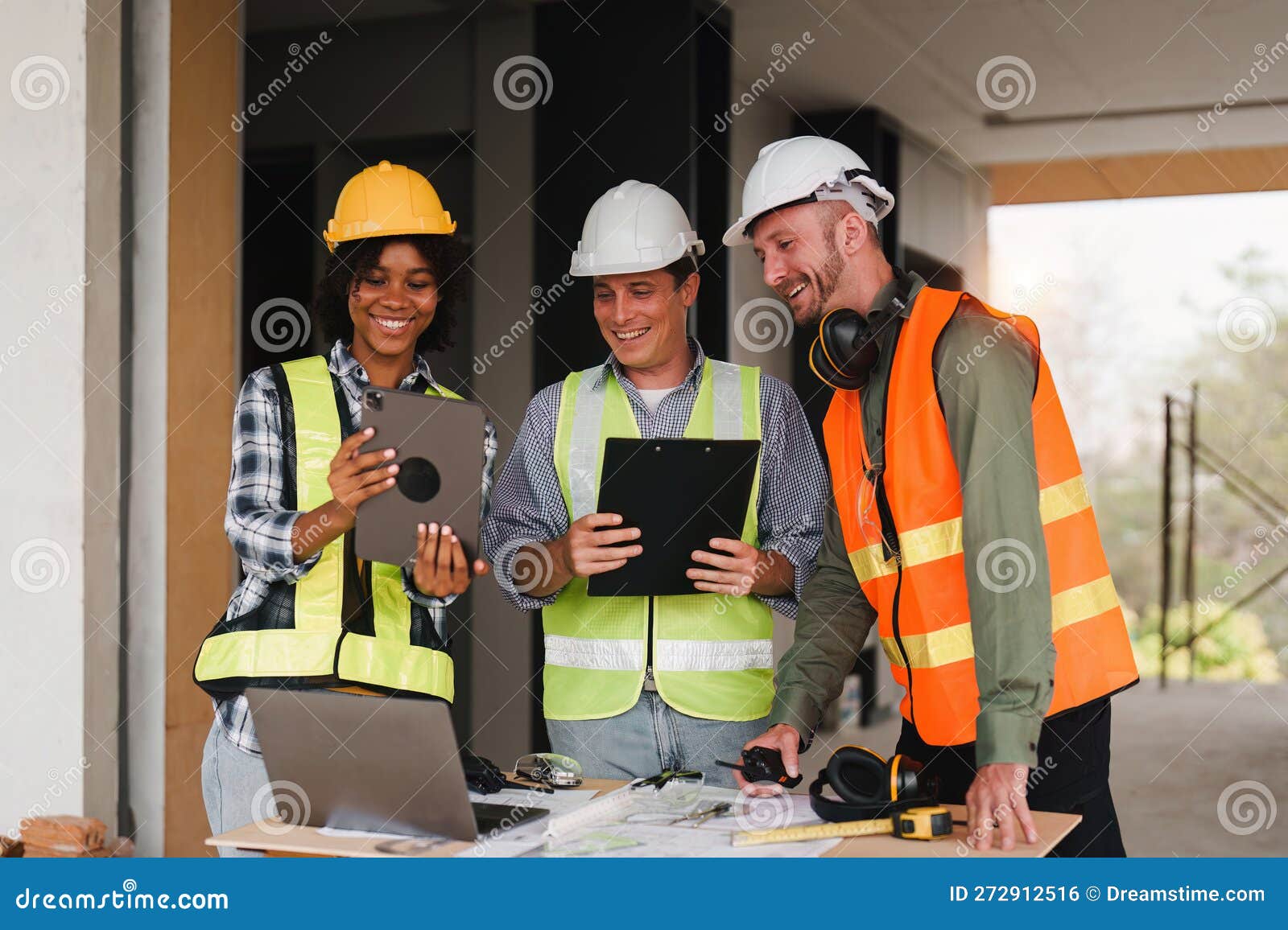 Engineer and Foreman Builder Team at Construction Site. American ...