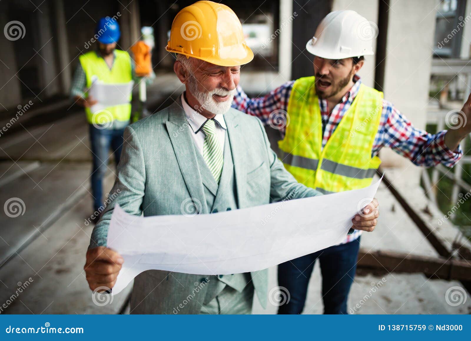 Engineer, Foreman and Worker Discussing in Building Construction Site ...